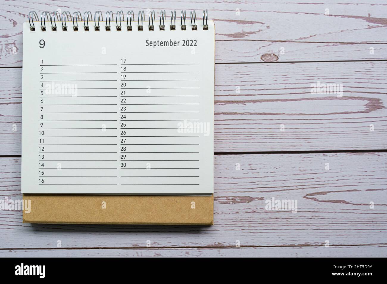 September planner and organizer 2022 calendar on wooden desk. Directly ...