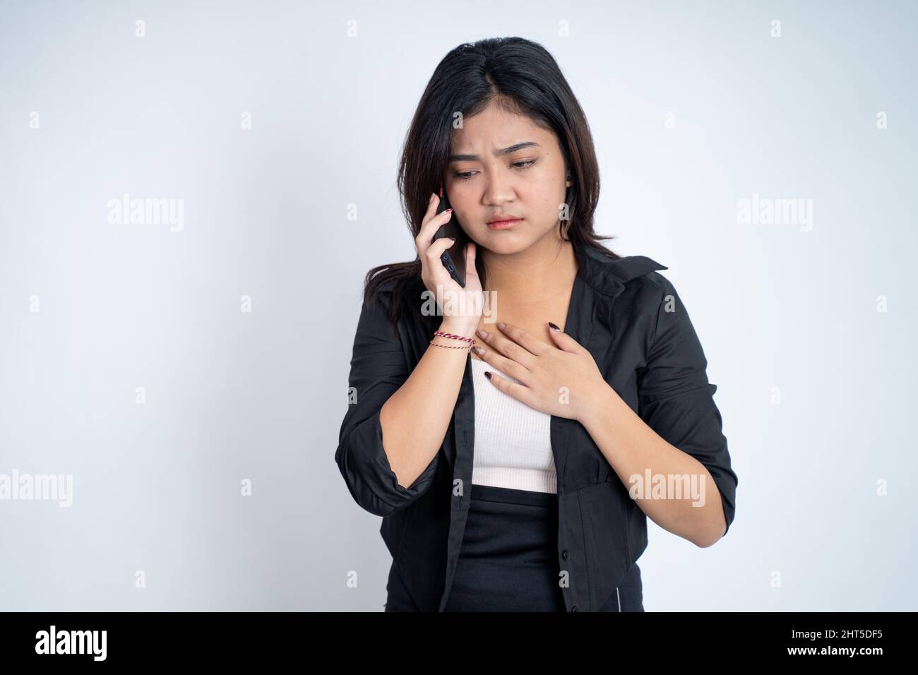 woman making a call when she hears bad news Stock Photo - Alamy