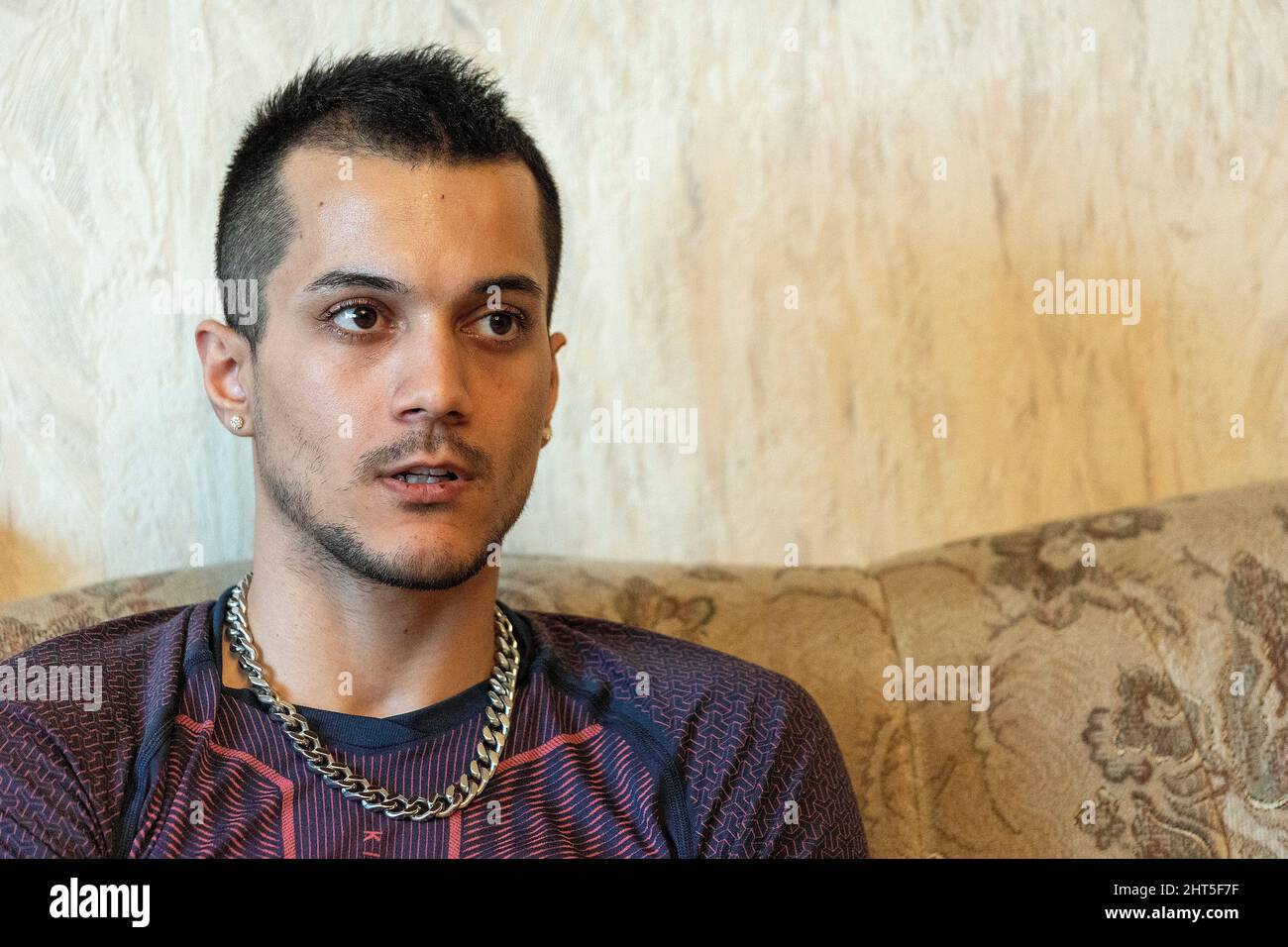 Berlin, Germany. 17th Feb, 2022. Amir Farahani is sitting on the sofa in the living room of A ...