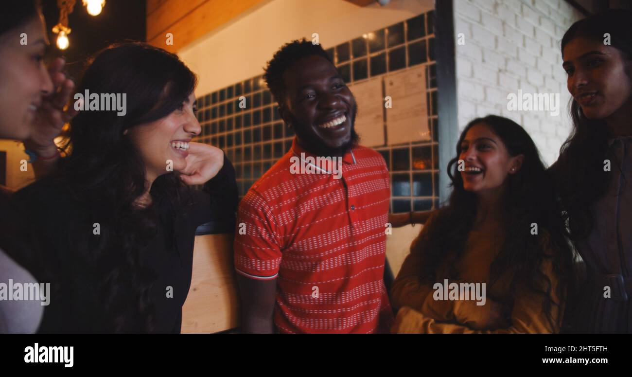 Group of South Asian friends laughing together - friendship concept ...