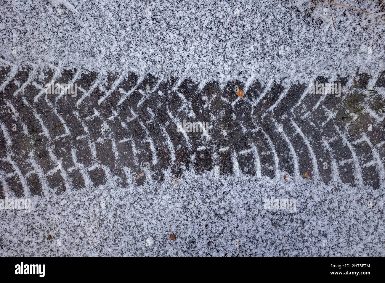 Top view of a tire track print on the snowy ground Stock Photo - Alamy