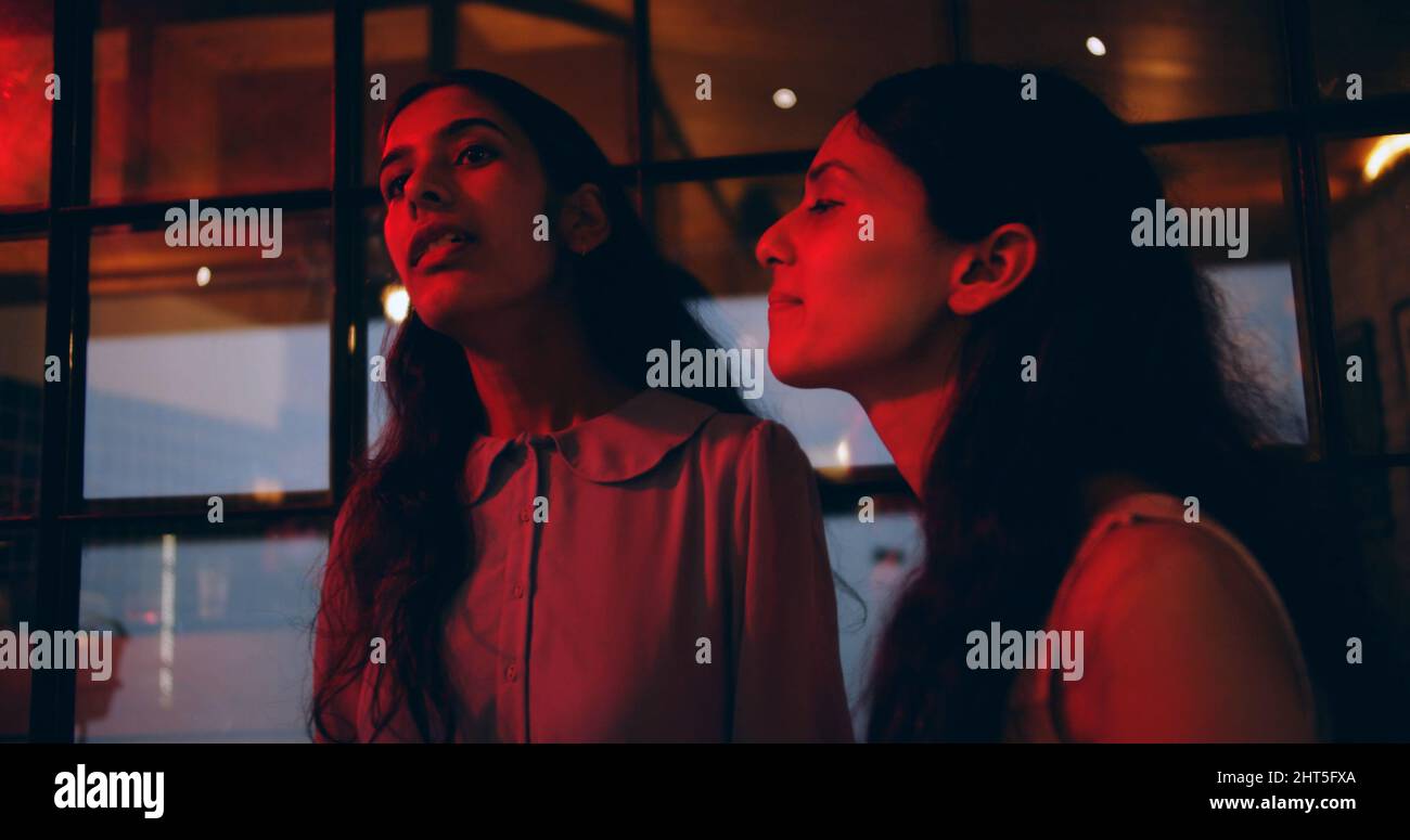 South Asian female friends at a party talking Stock Photo - Alamy