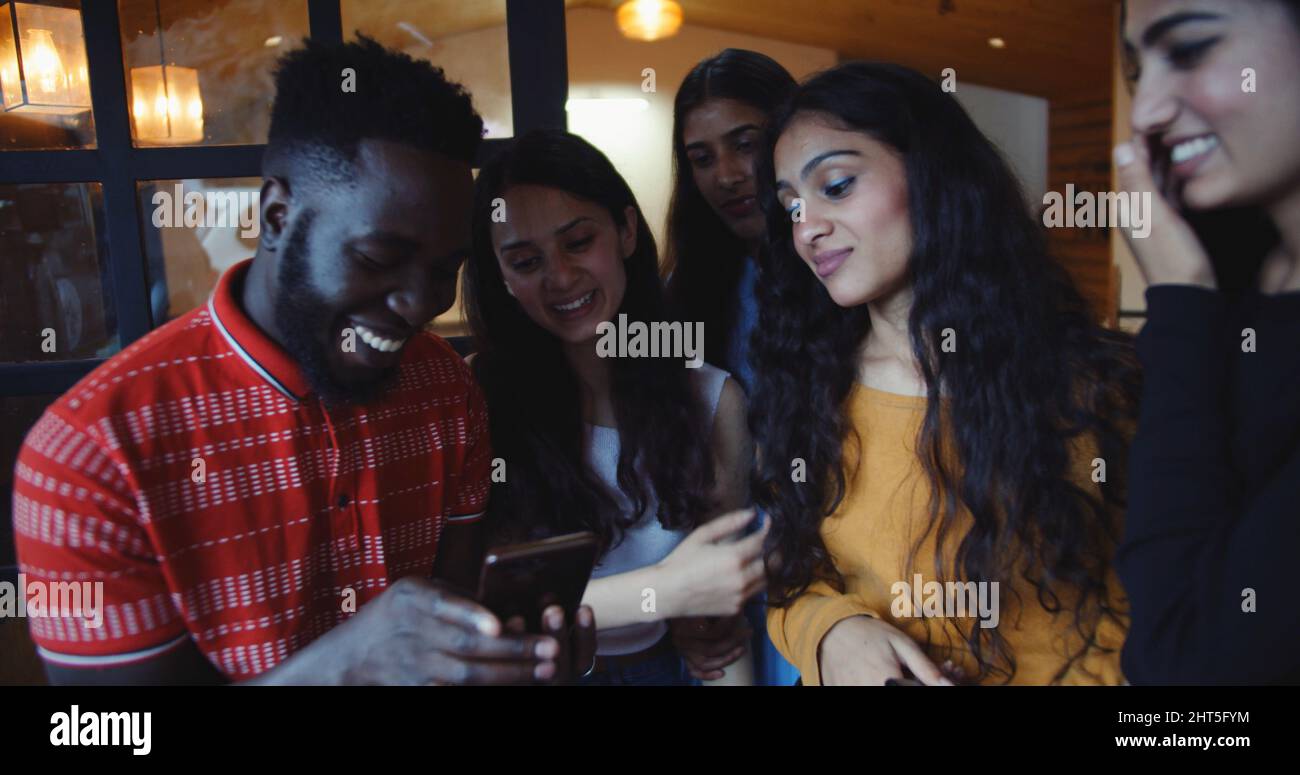 Group of South Asian friends laughing together - friendship concept ...