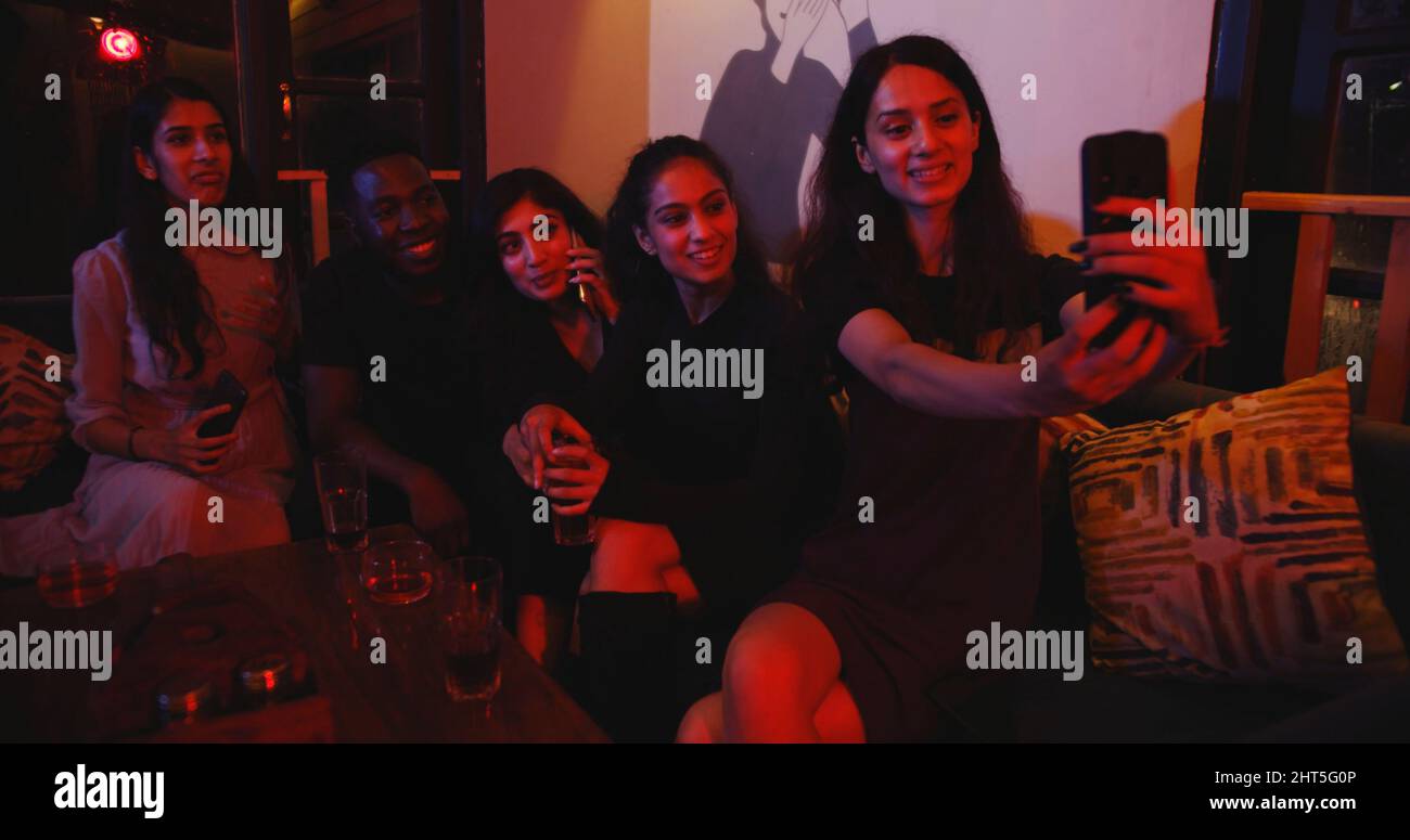 Group of South Asian friends taking a selfie at a party Stock Photo - Alamy