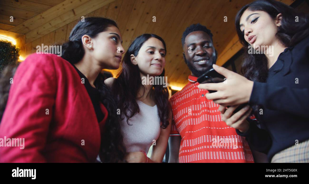 Group of South Asian friends laughing together - friendship concept ...