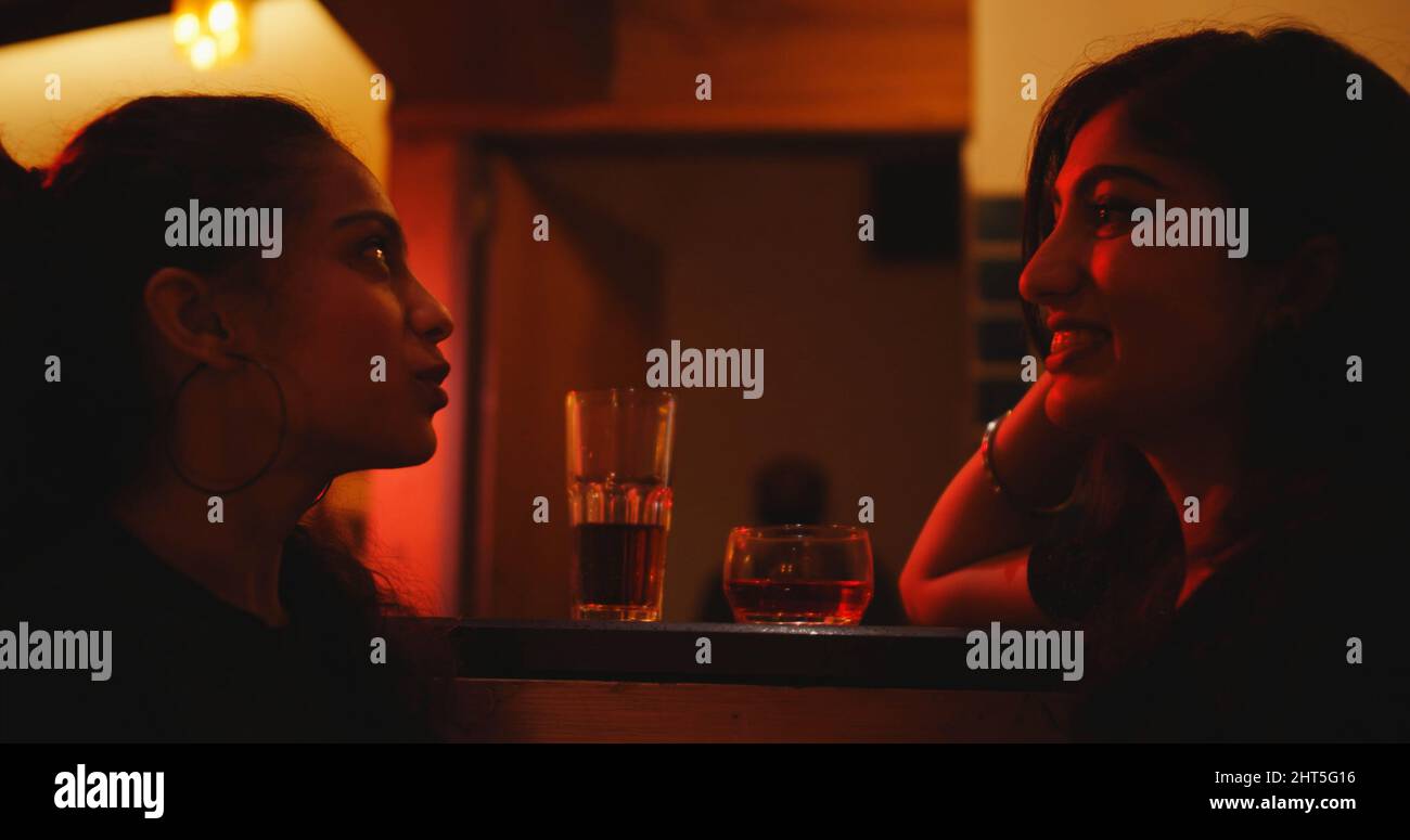 South Asian female friends at a party talking Stock Photo - Alamy