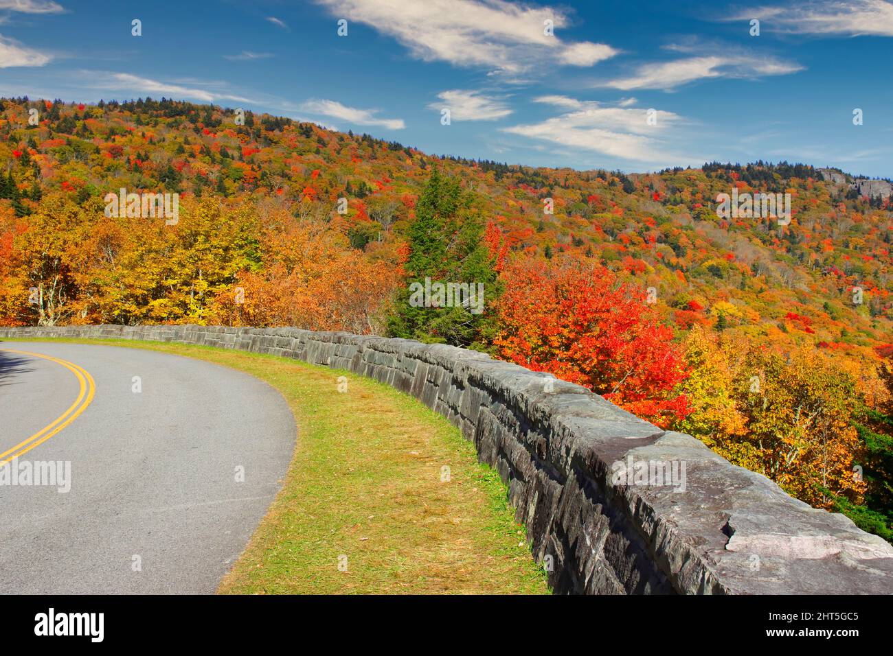 Beautiful view of empty highway along colorful autumn trees in Blue ...