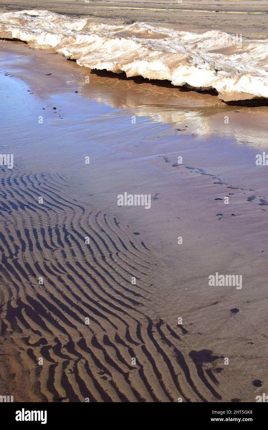 A vertical photo of salt rock formation on a sea shore Stock Photo - Alamy