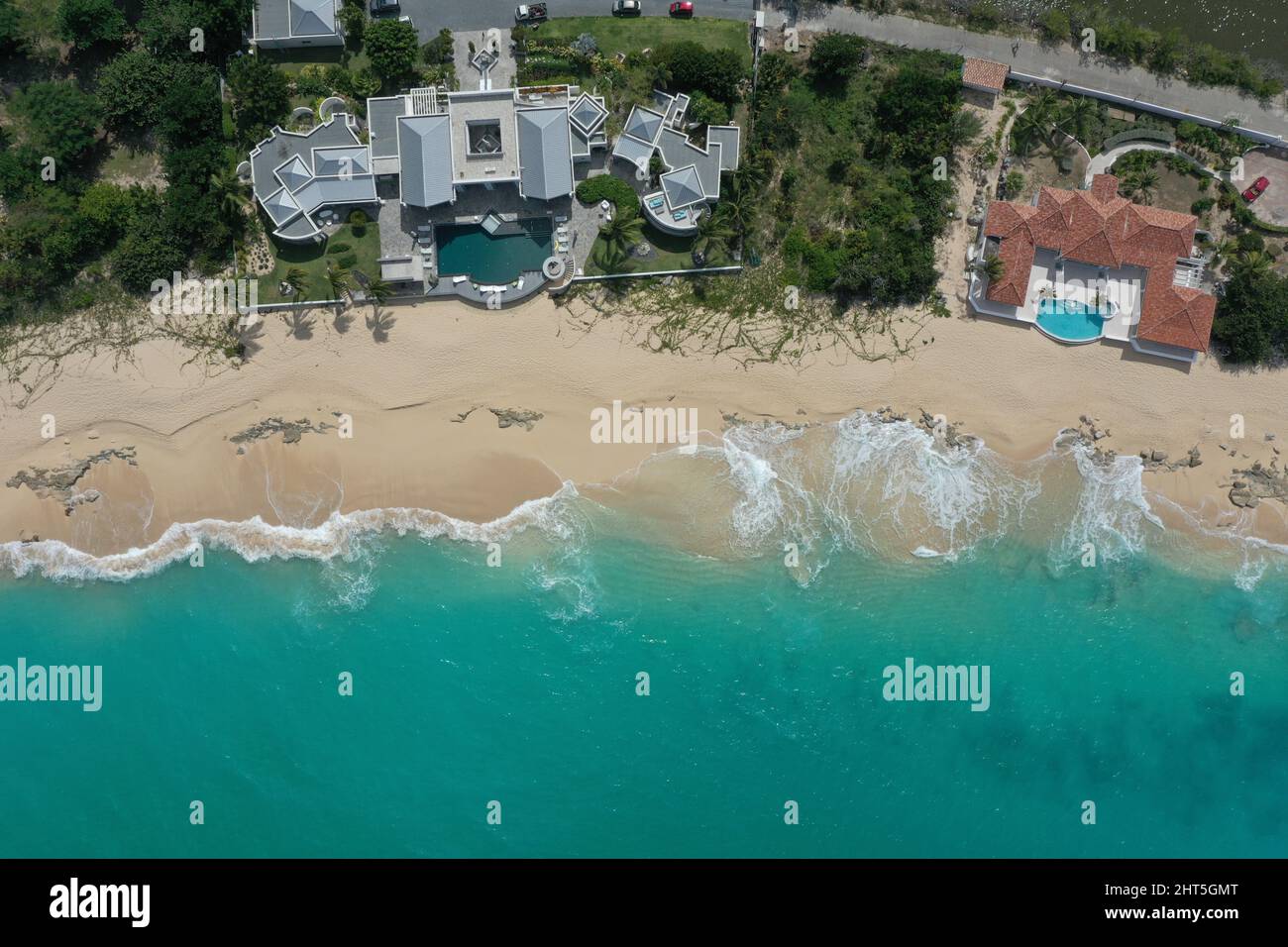 Aerial view of the sea waves touching the sandy beach of St. Martin ...