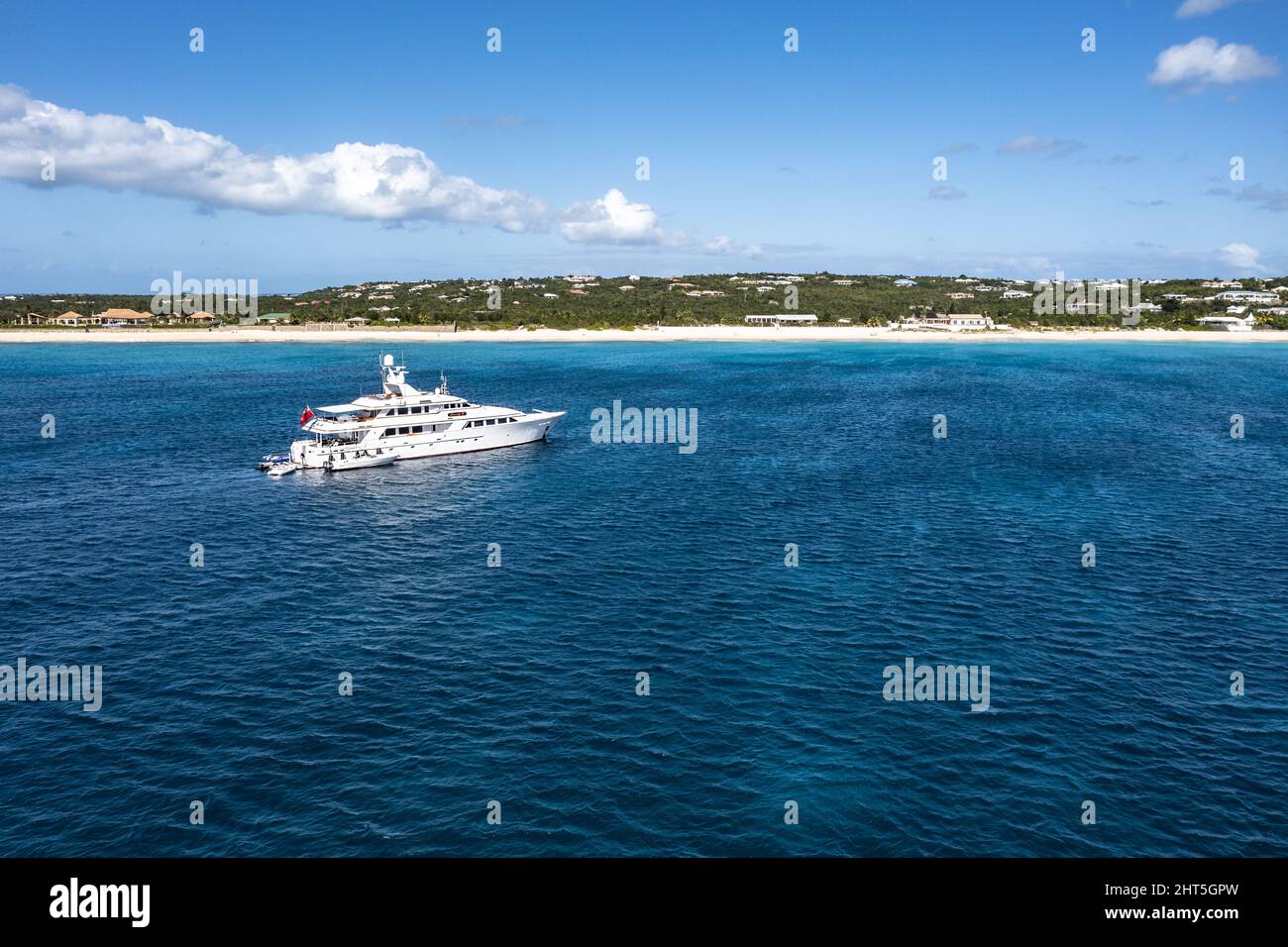 Aerial view of a yacht sailing on the sea in St. Martin, Baie Longue ...