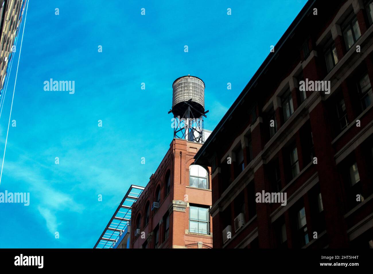 Low-angle shot of a water tower building under a clear blue sky Stock ...