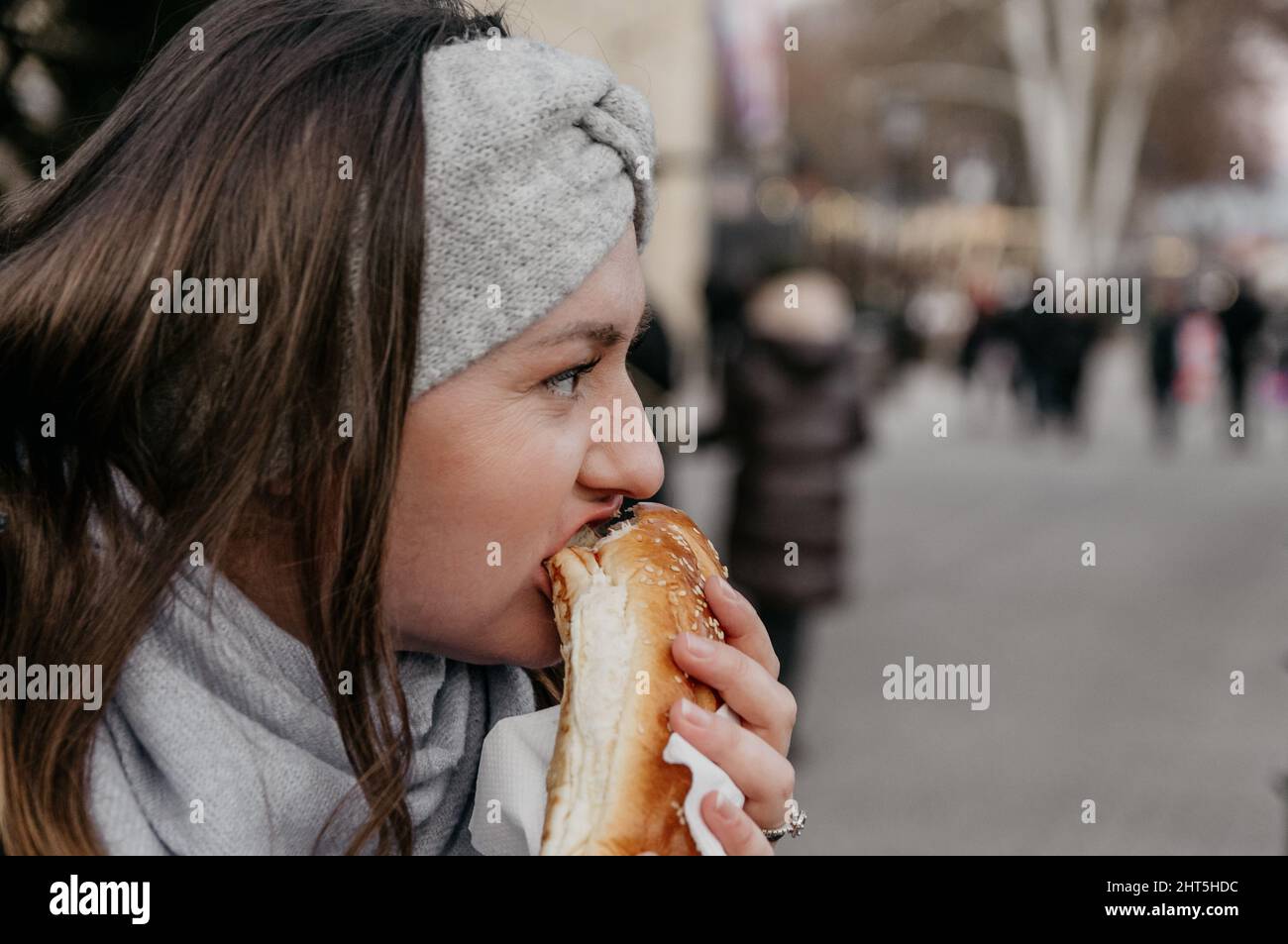 Woman taking tasty hot dog hi-res stock photography and images - Alamy