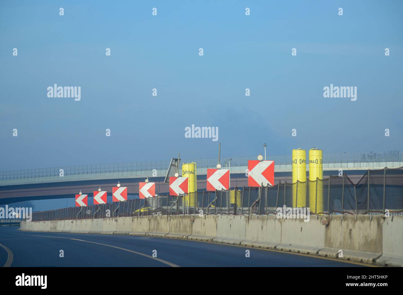 Closeup of a work in progress caution turn sign in Milan, Italy Stock ...