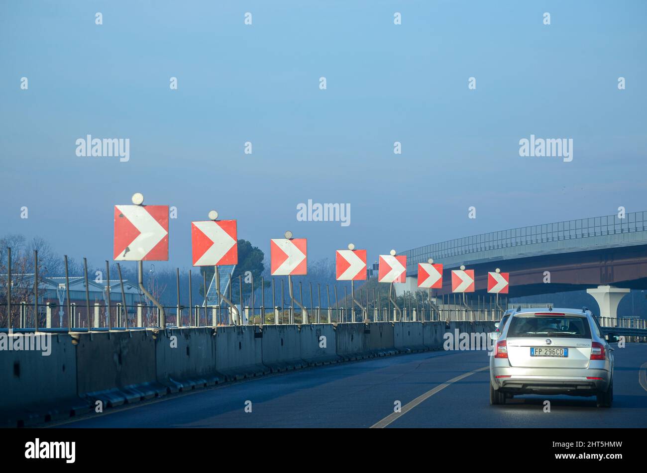Closeup of a work in progress caution turn sign in Milan, Italy Stock ...