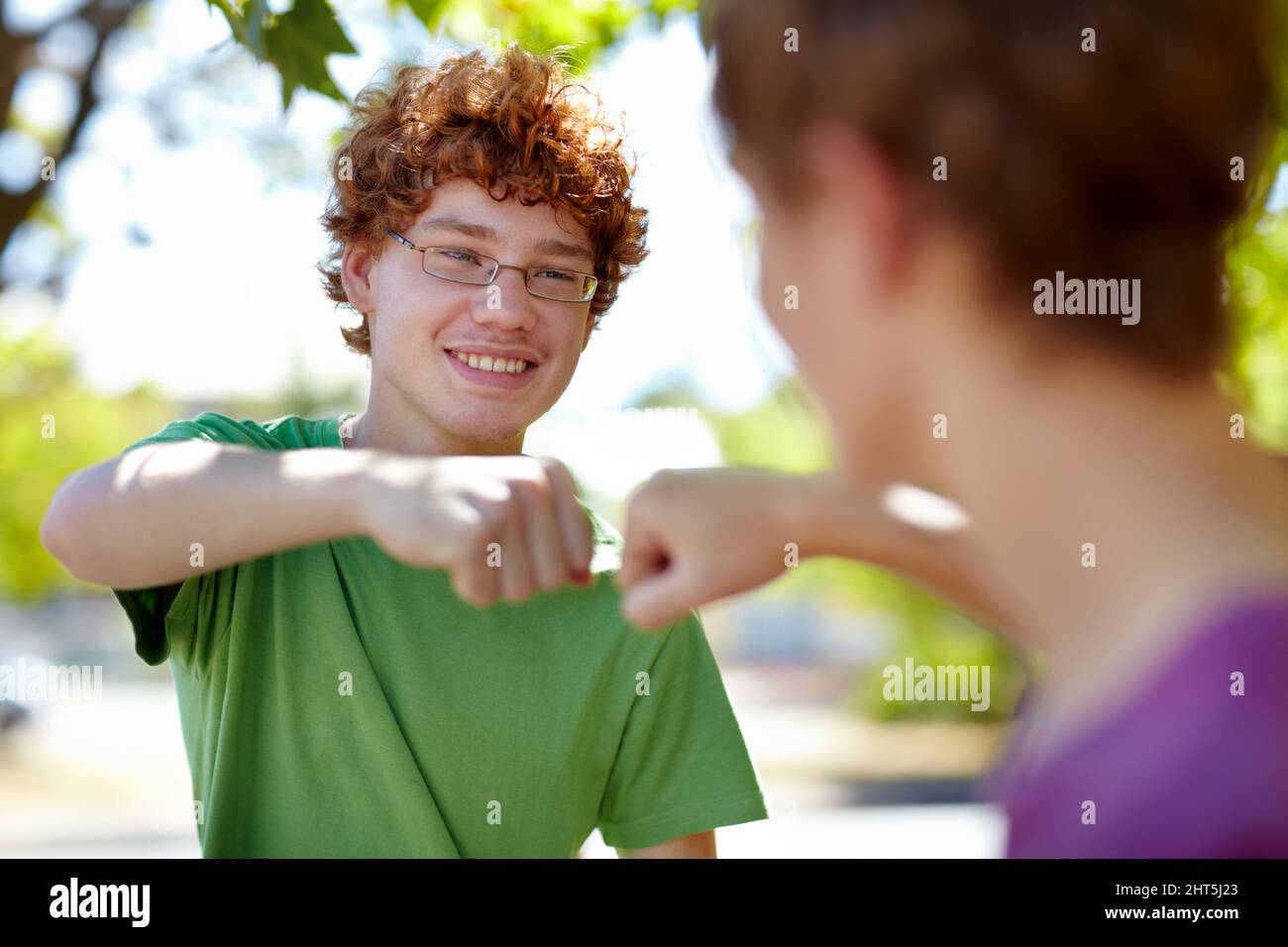 Best bud bump. Cropped shot of two teenage boys fist bumping Stock ...