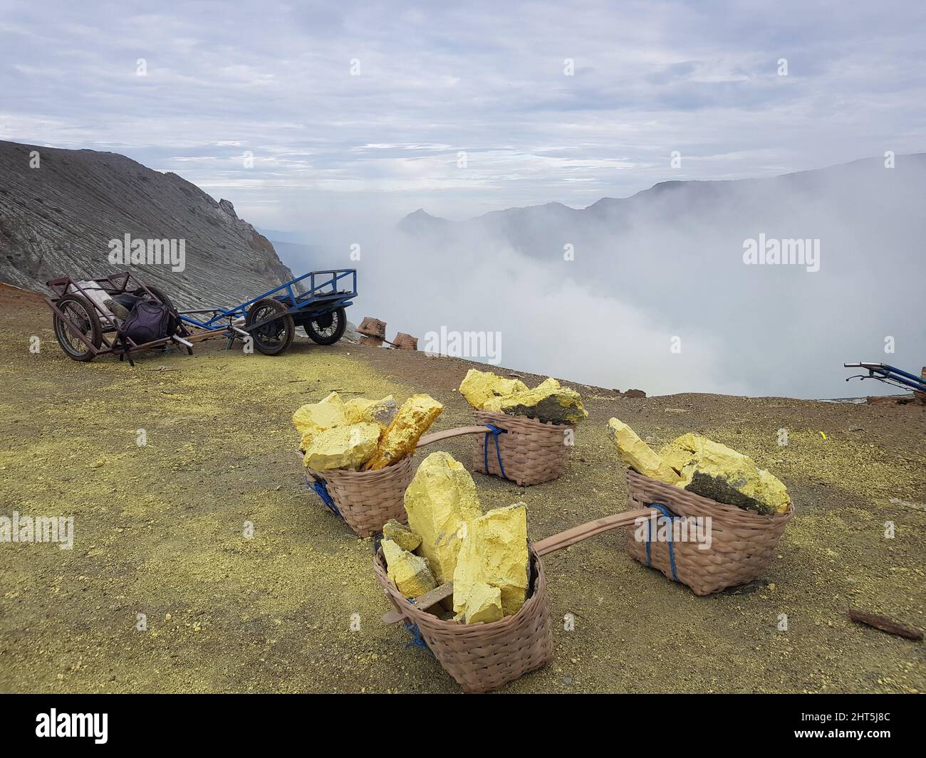Scenery of trike bike and baskets with sulfur on Ijen volcano in Indonesia Stock Photo - Alamy