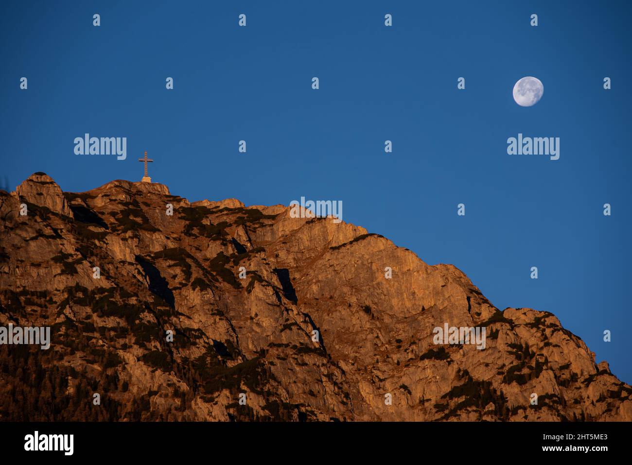 Beautiful view of a mountain against blue sky with a moon in Busteni ...