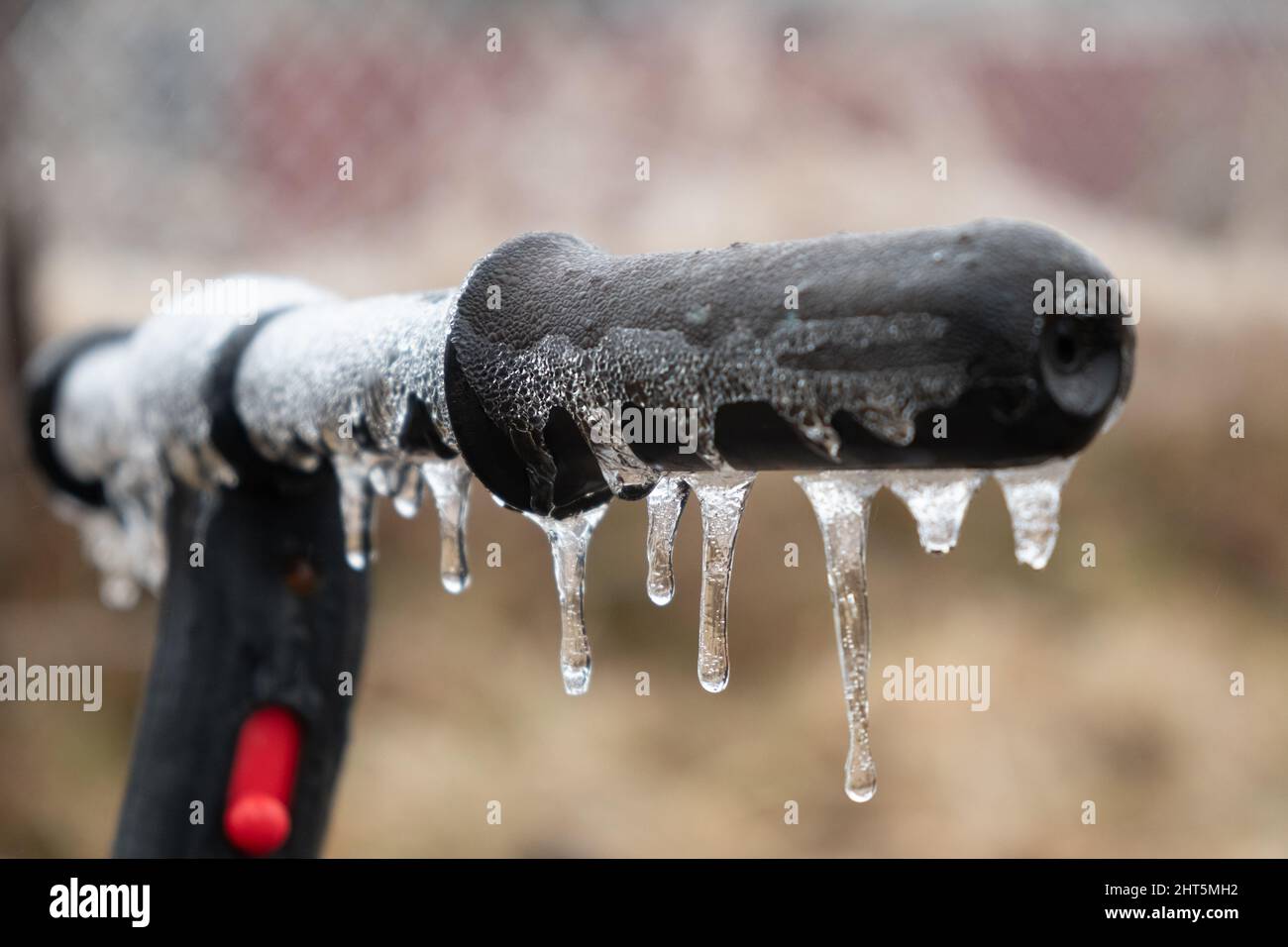 frozen icy scooter wheel..in icicles, cold weather Stock Photo - Alamy