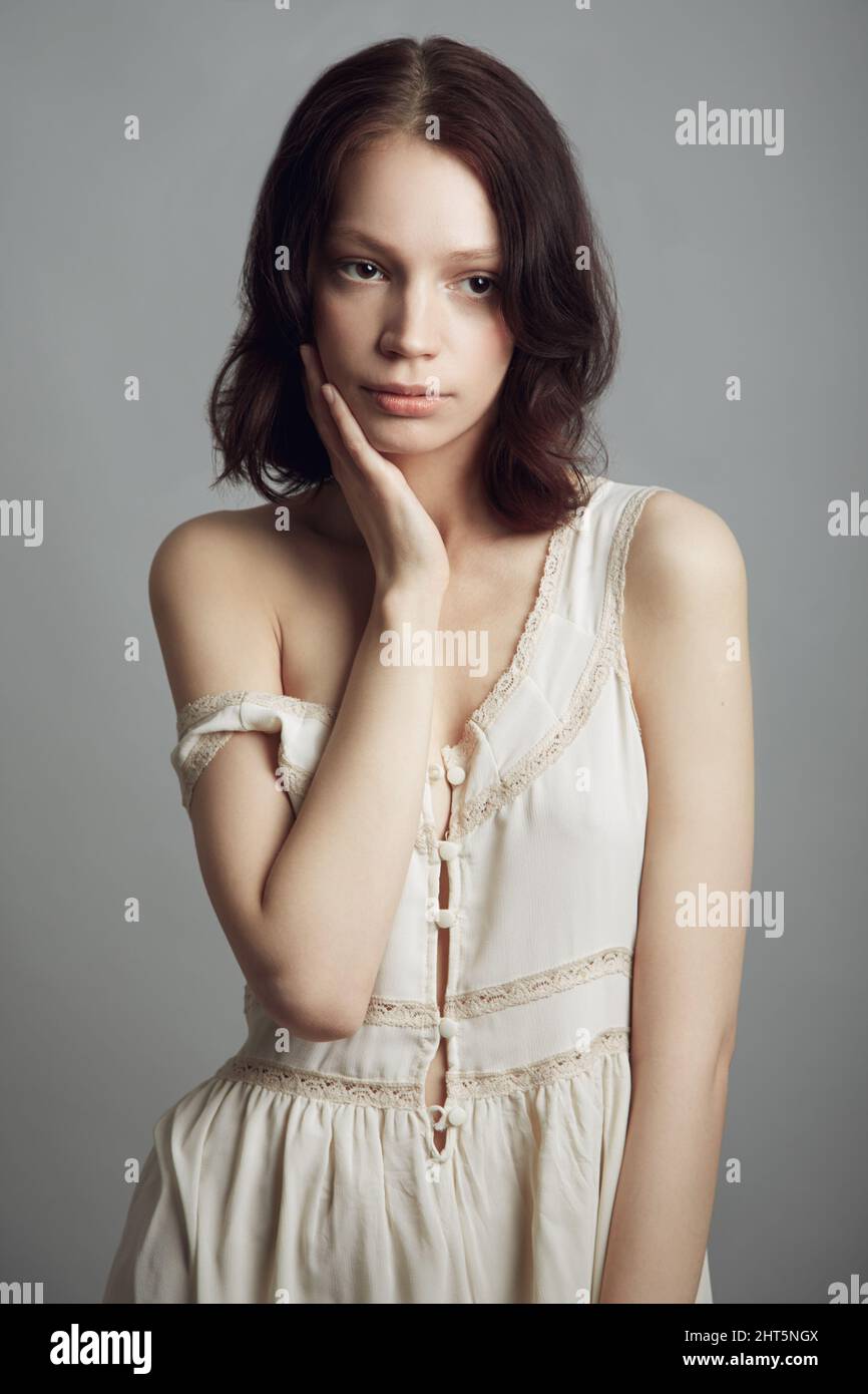 Feminine fragility. Portrait of a beautiful young woman wearing vintage ...
