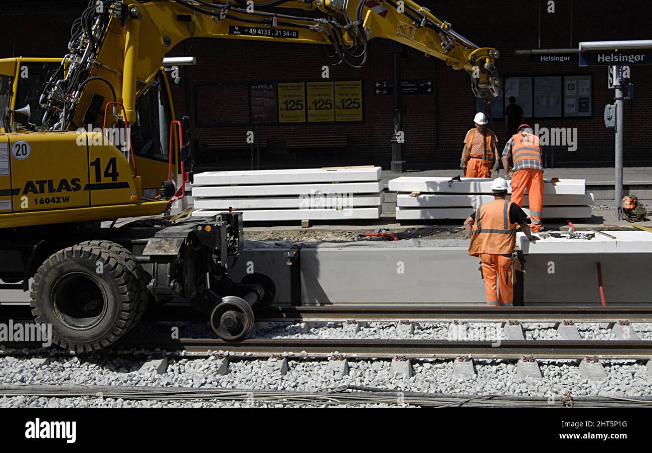 HELSINGOER / Denmark. Contruction workers working on new train tracks ...