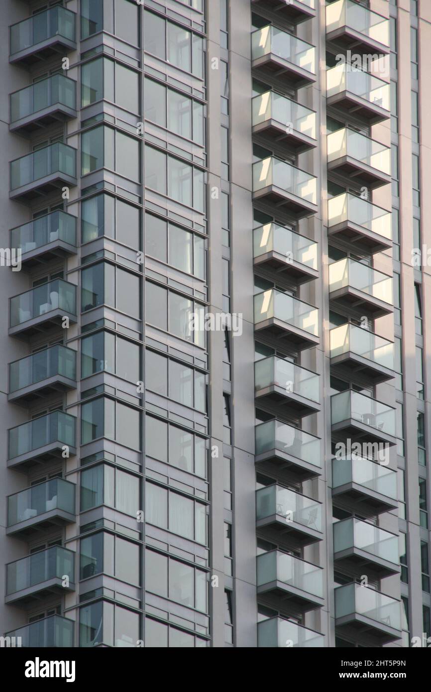 Vertical of glass windows and balconies of a modern building in London ...
