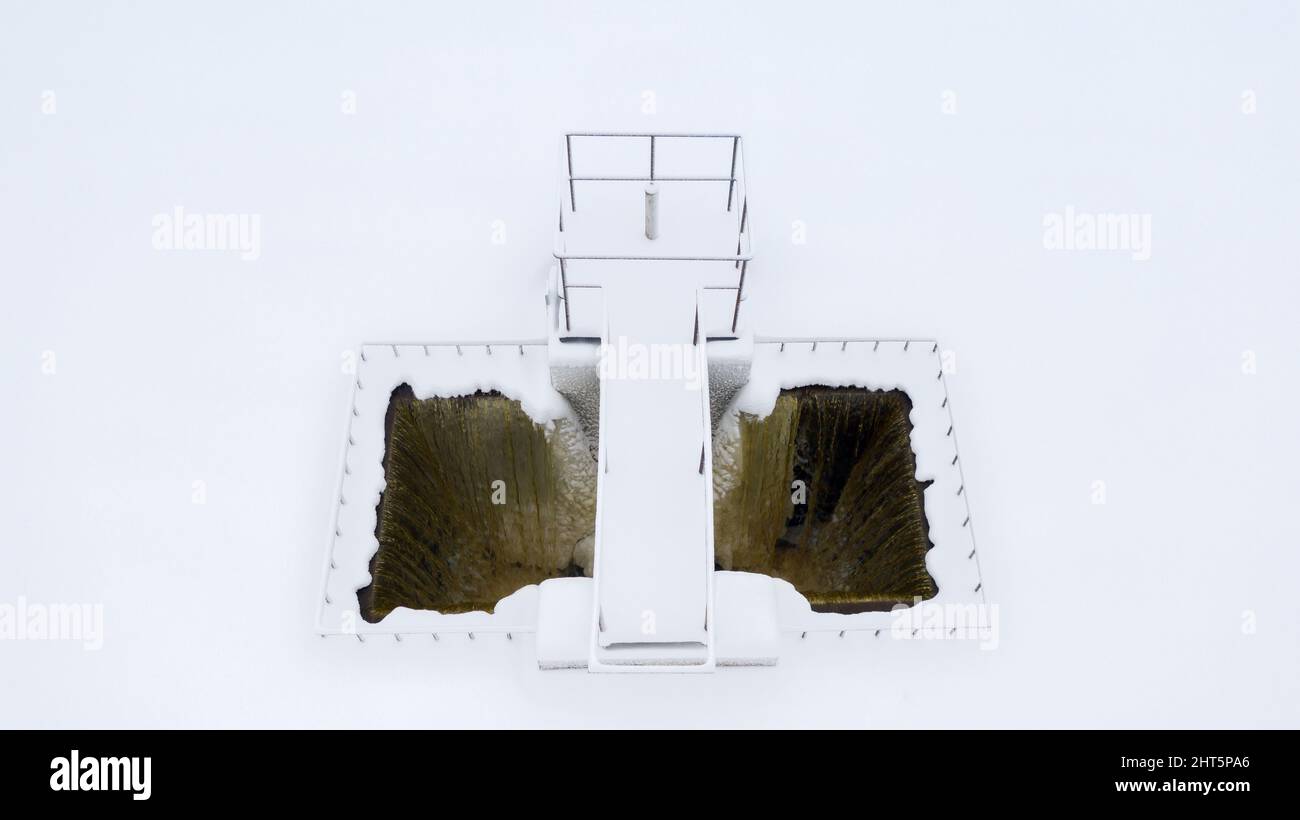 Top view of a well covered with snow Stock Photo - Alamy