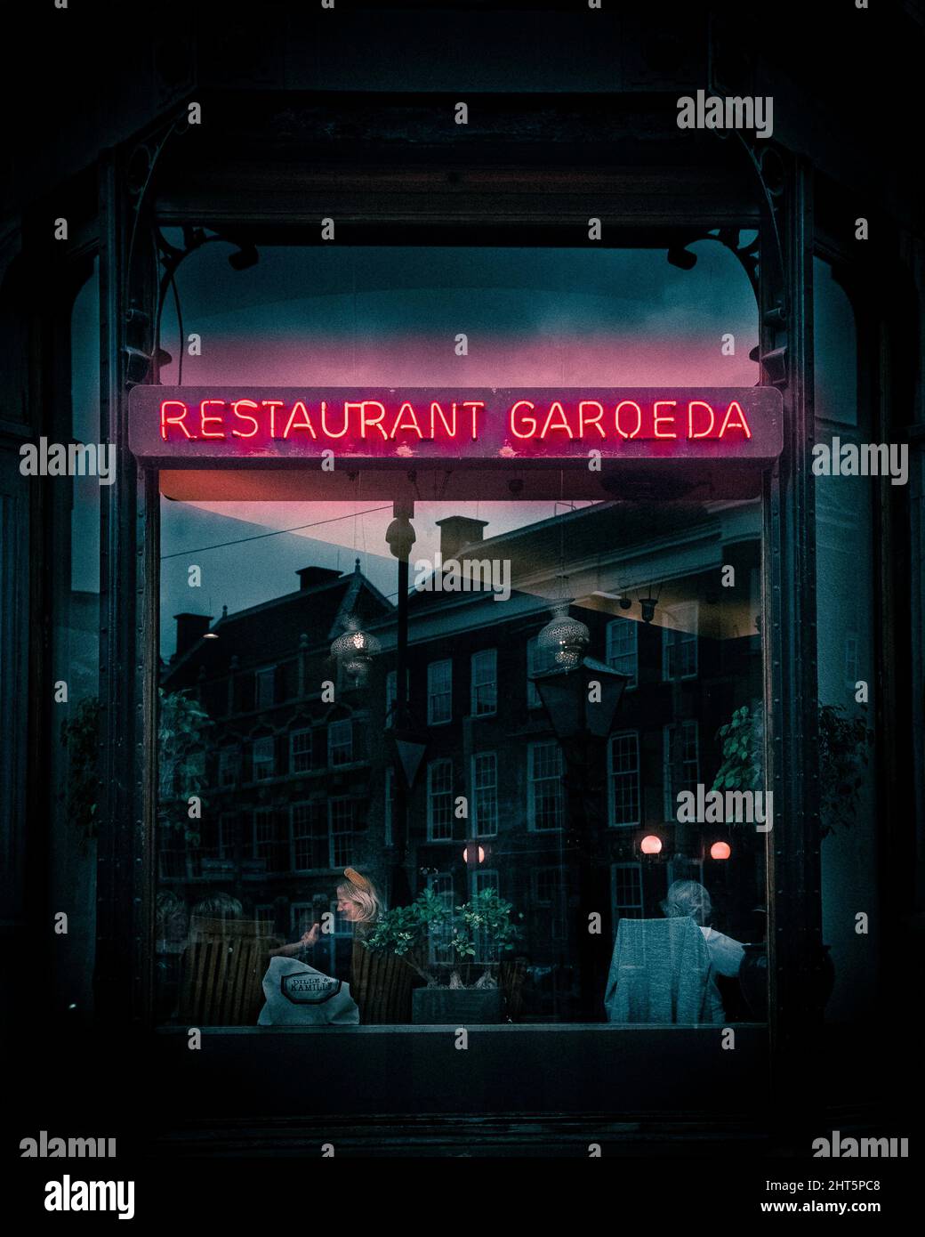 Closeup of restaurant garoeda neon pink sign Stock Photo - Alamy