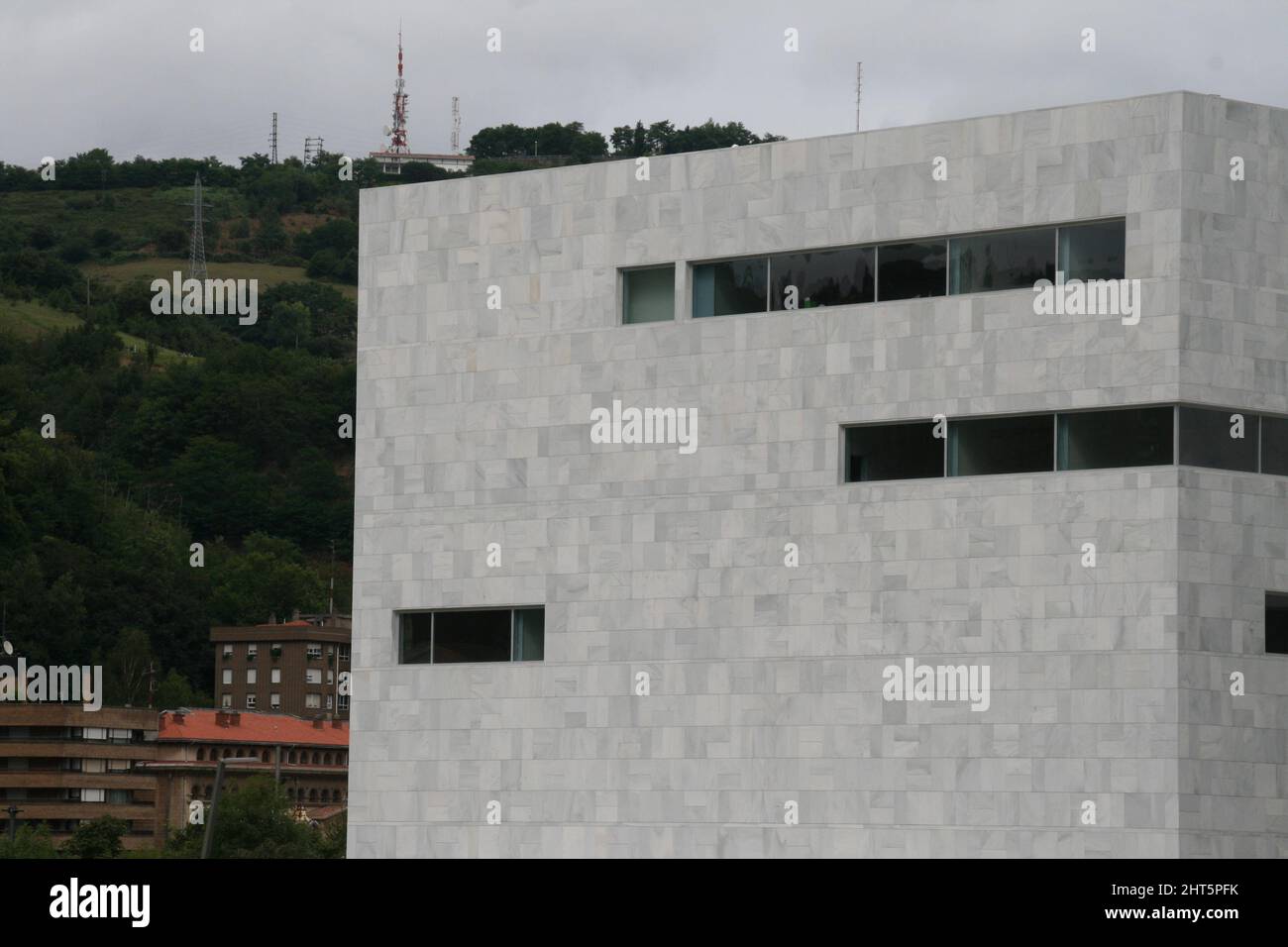 Photo of a white stone modern building in a city Stock Photo - Alamy
