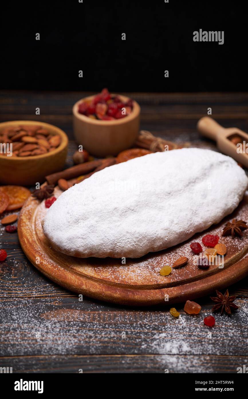 Traditional Christmas stollen cake recipe with ingredients on wooden ...