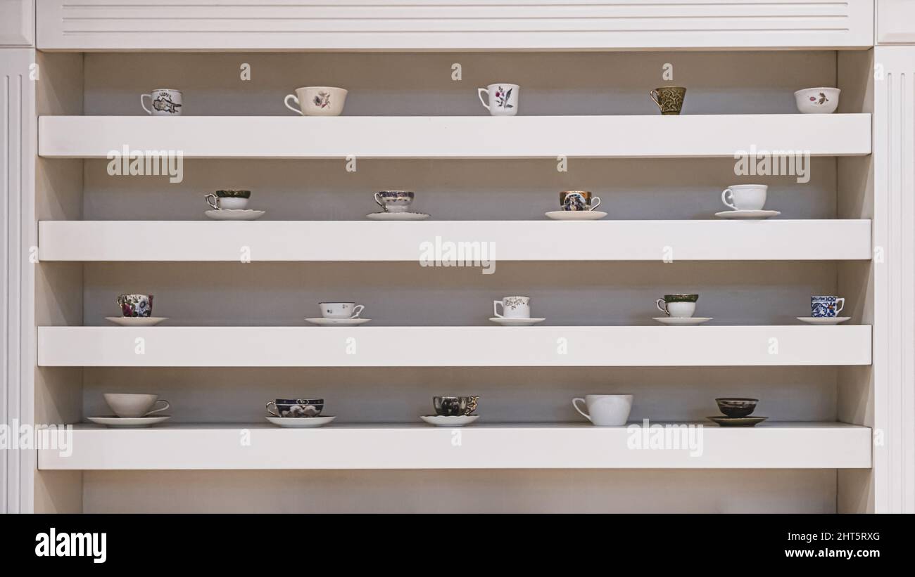 Porcelain coffee cups are on wooden shelves Stock Photo - Alamy