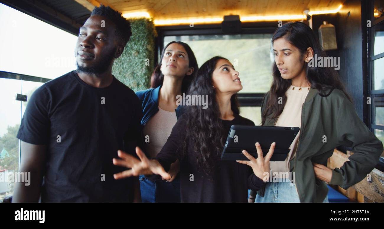 Closeup Shot Of A Black Young Male Standing And Three South Asian Girls