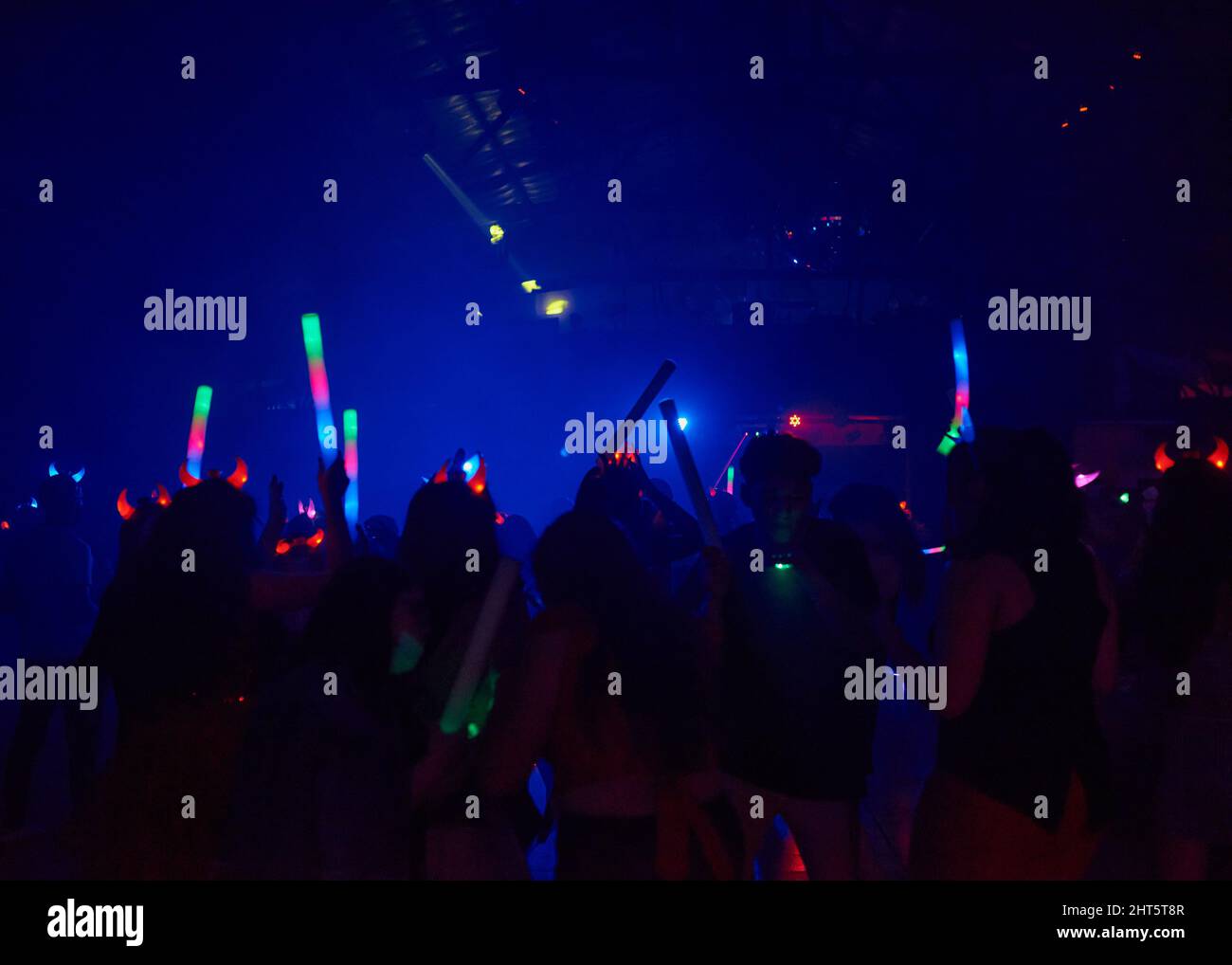 People dancing in the club with neon lights Stock Photo - Alamy