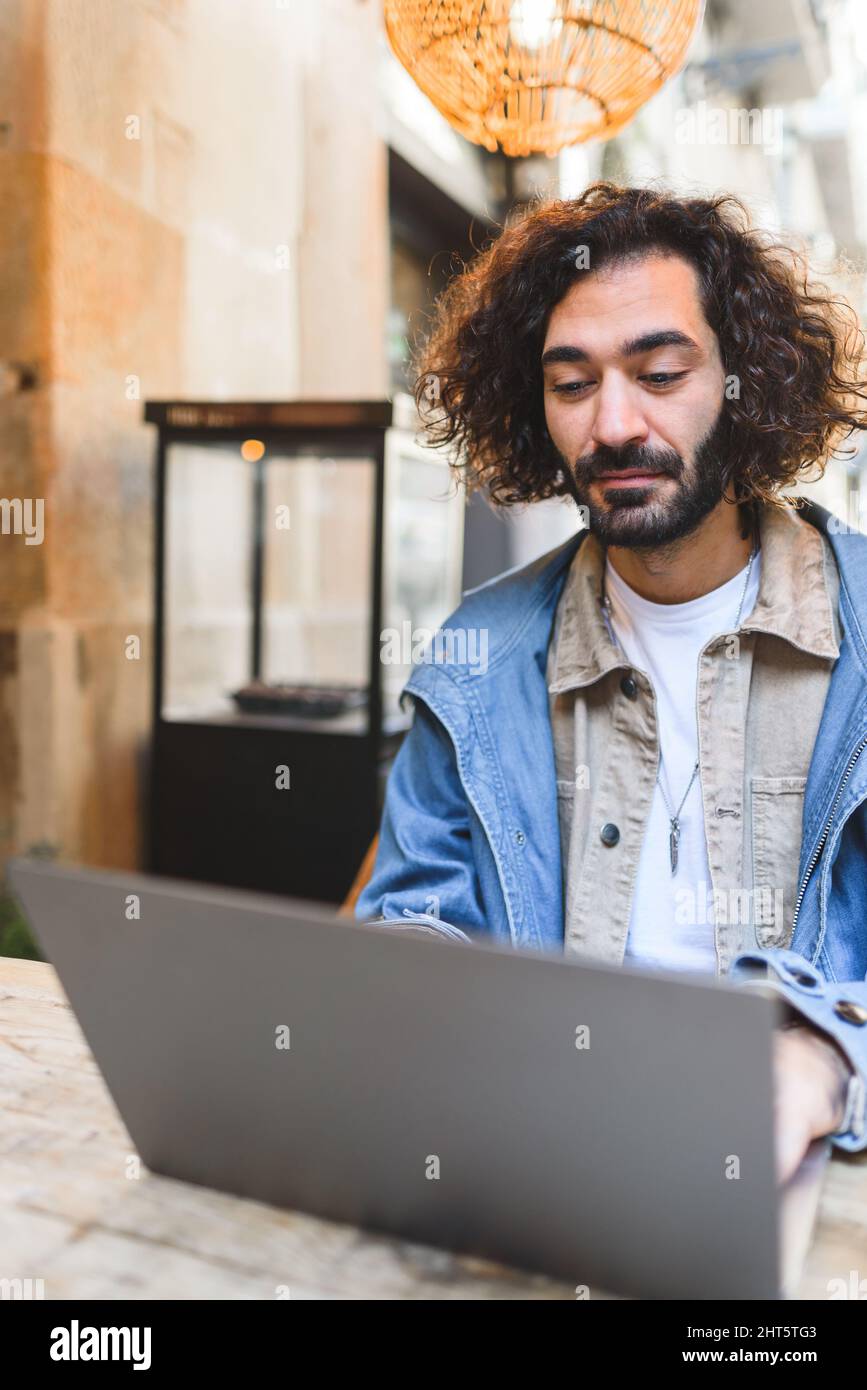 Bearded hispanic freelancer sitting hi-res stock photography and images ...