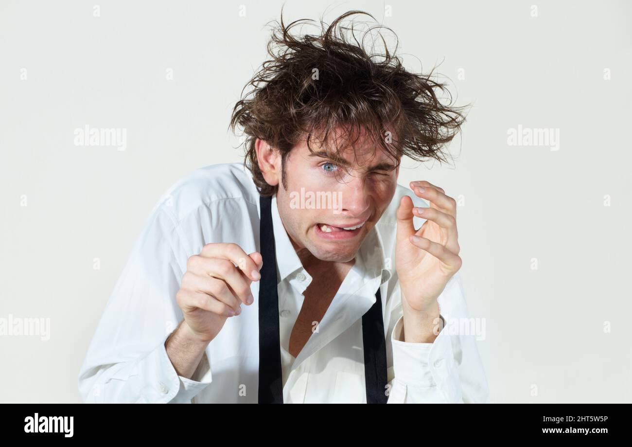 Cracked. A crazy young man going crazy - Isolated Stock Photo - Alamy