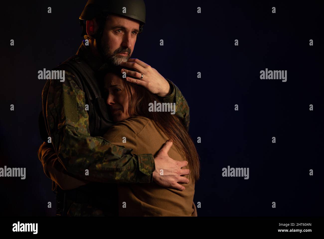 Army uniform man hugging hi-res stock photography and images - Alamy