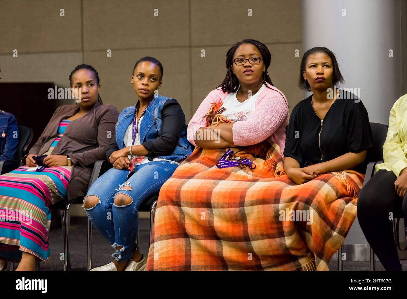 Diverse adult students attending a class on finance in Johannesburg ...