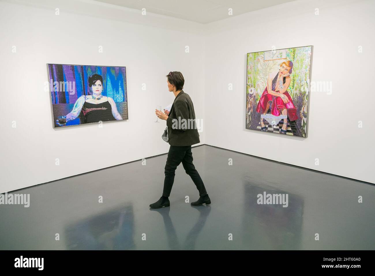 Visitor viewing art exhibit in gallery in Johannesburg, South Africa ...