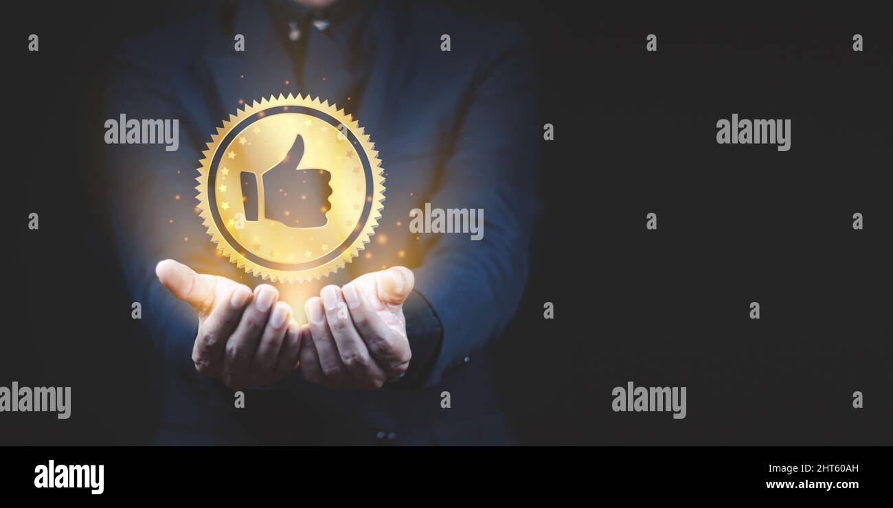 Quality product symbol in the hand of a business man.Hand shows the ...