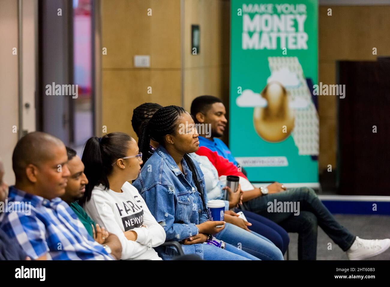 Diverse adult students attending a class on finance in Johannesburg ...