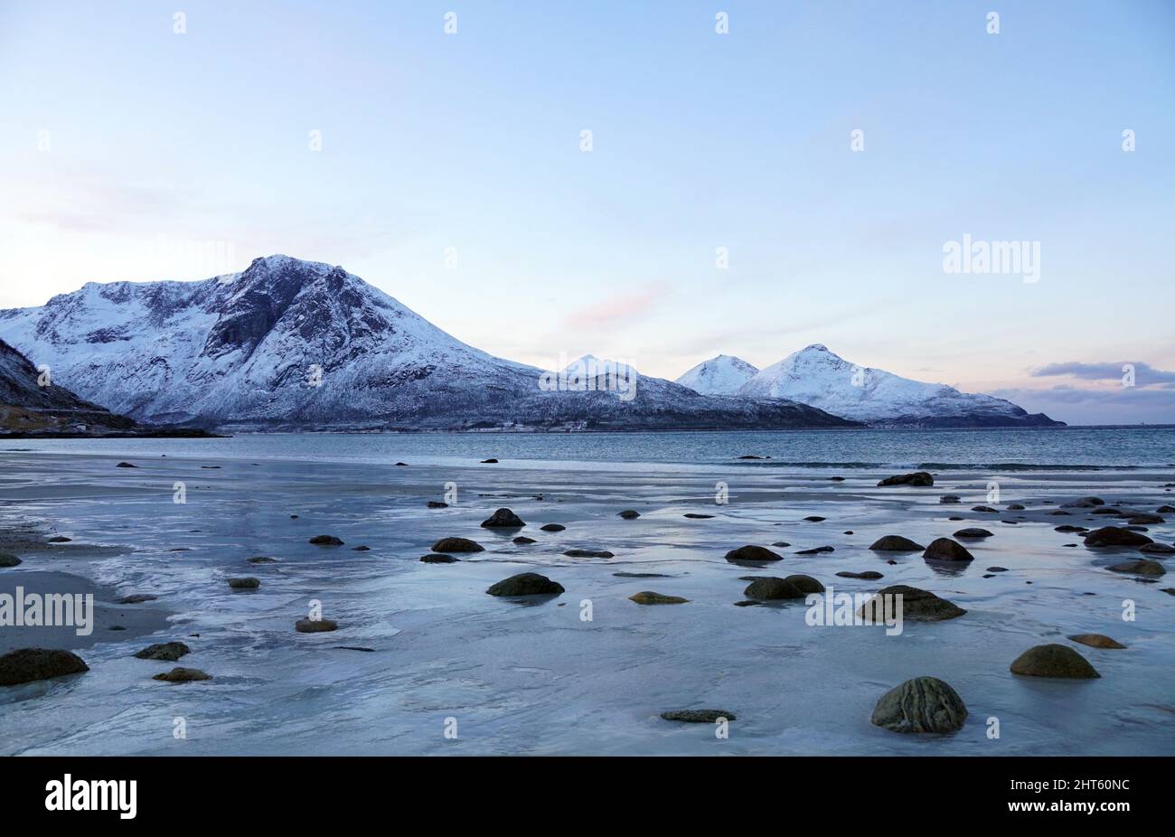 Stunning view of snowy mountains in Grotfjord, Norway Stock Photo - Alamy