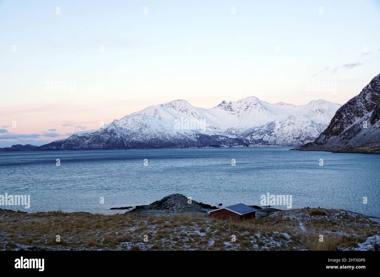 Stunning view of snowy mountains in Grotfjord, Norway Stock Photo - Alamy