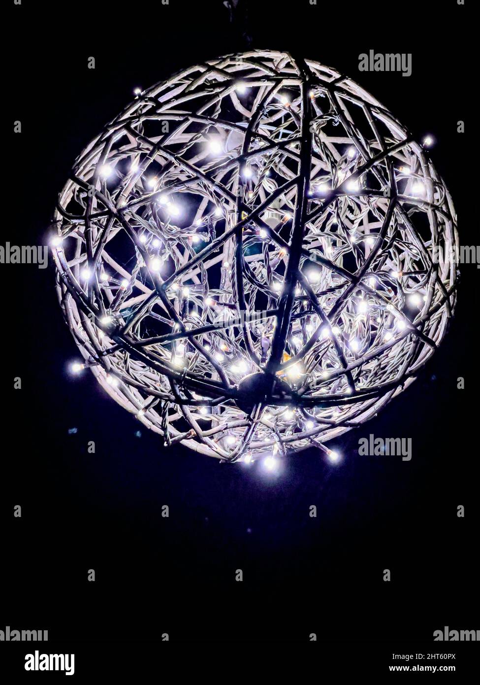 Vertical shot of a spark ball shining in the dark Stock Photo - Alamy