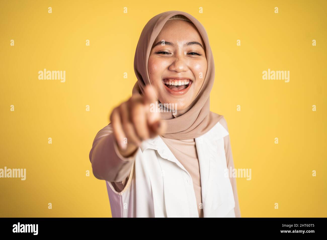 muslim woman with finger pointing laughing at something Stock Photo - Alamy