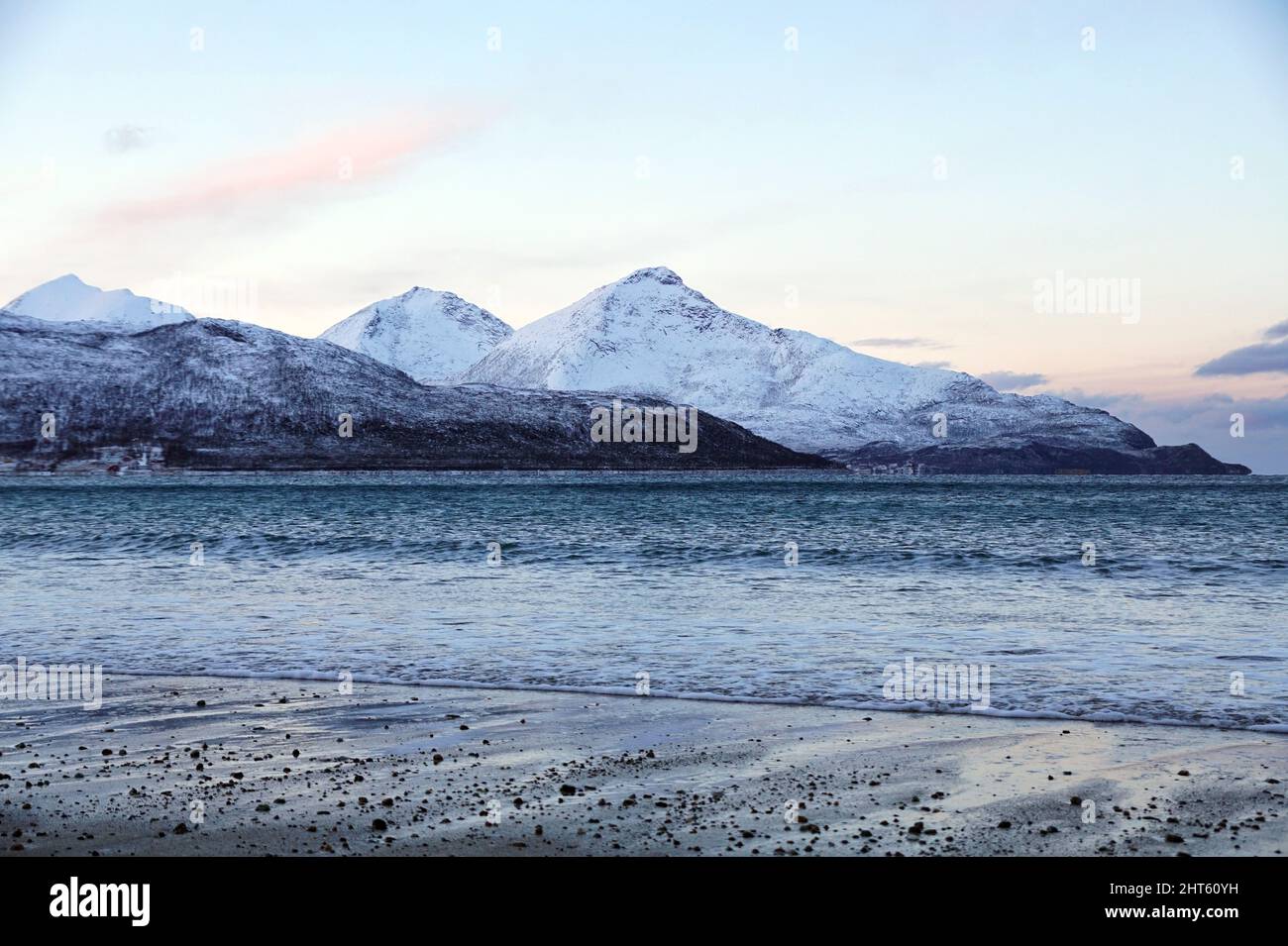 Stunning view of snowy mountains in Grotfjord, Norway Stock Photo - Alamy