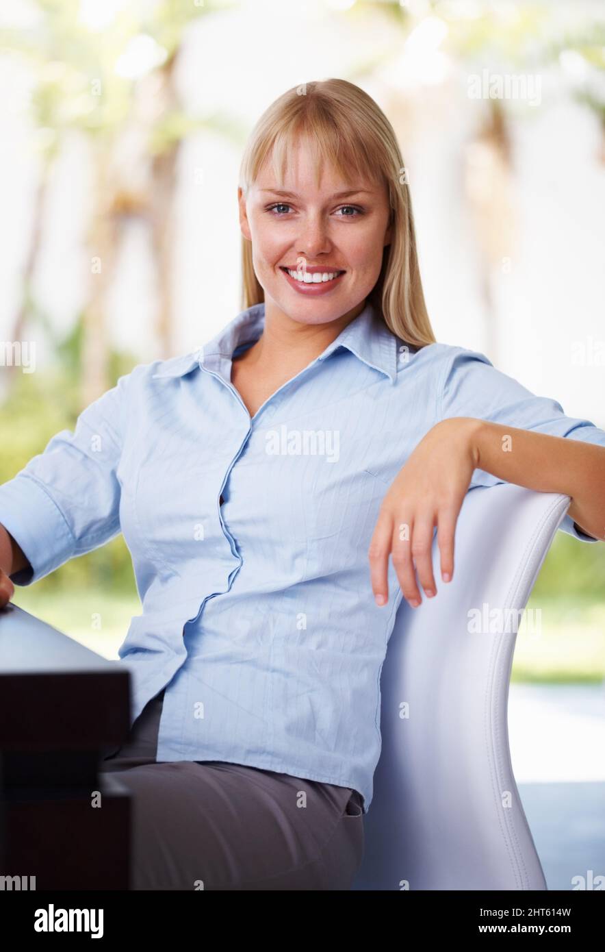 Business woman at her desk. Portrait of confident female executive ...