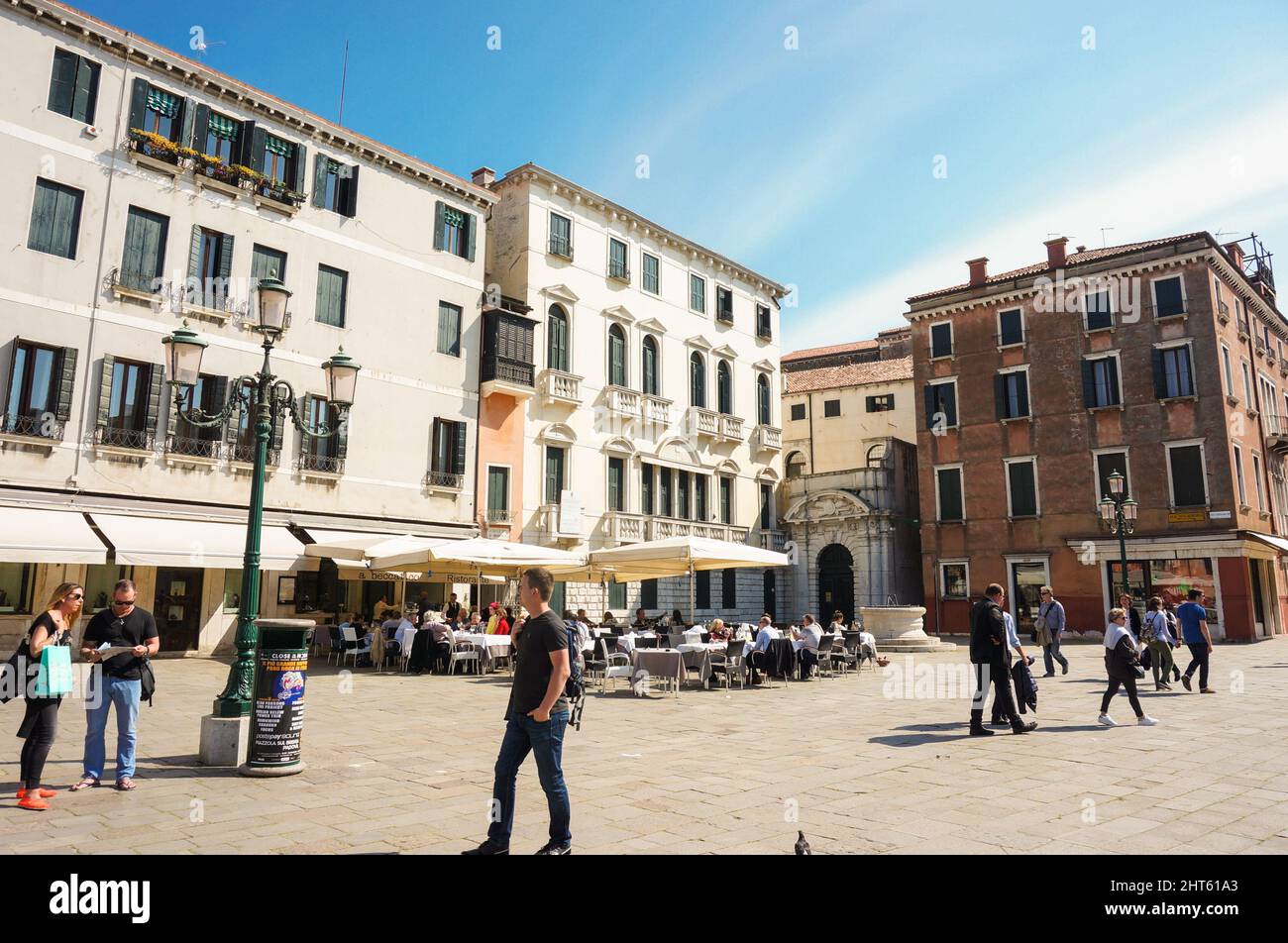 View of people walking on a square with buildings in the city center ...