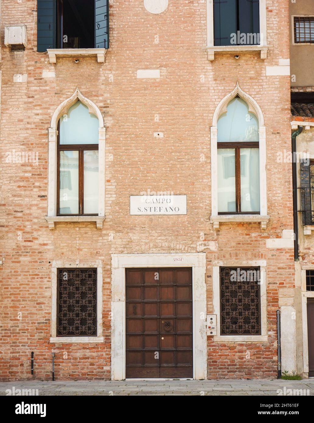 A front of an old building with wooden door Stock Photo - Alamy