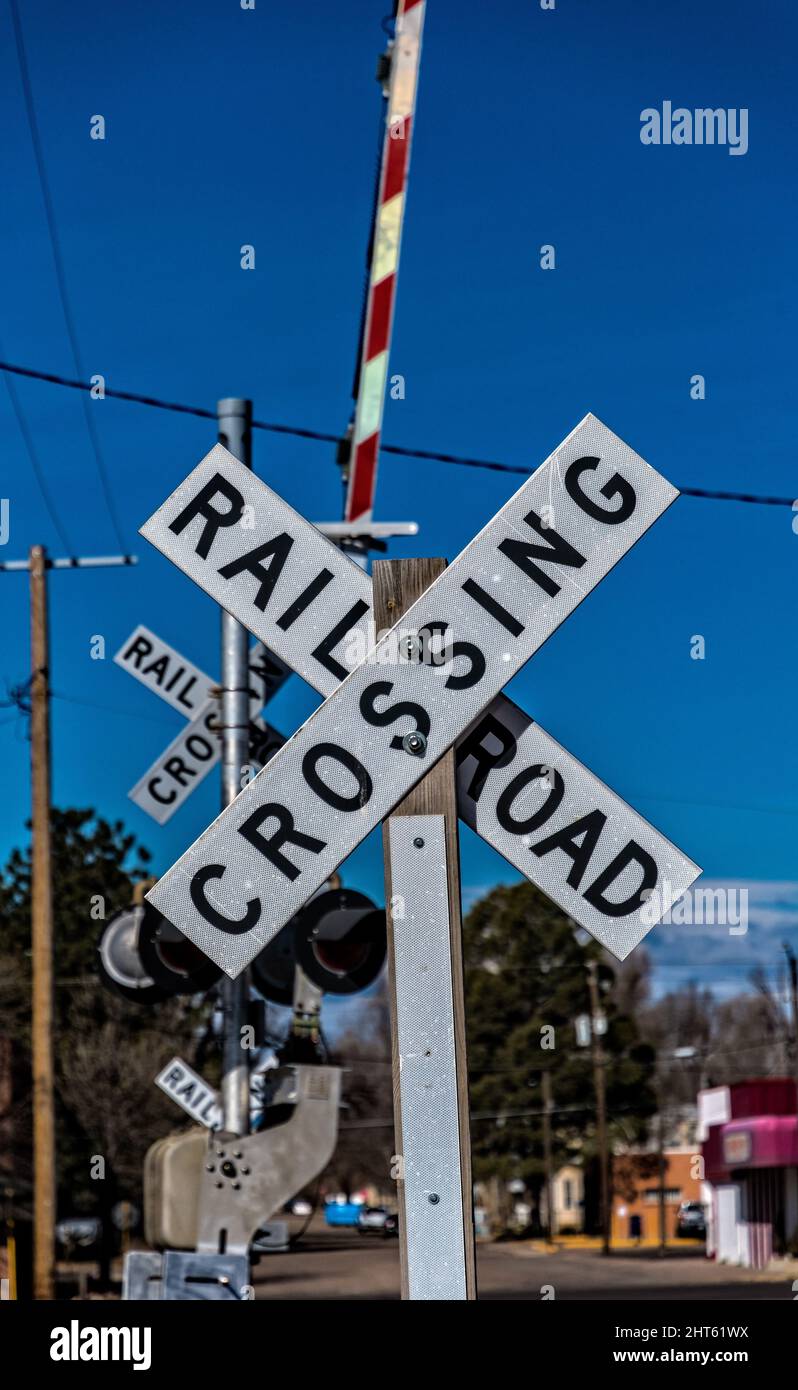 Vertical shot of a Railroad Crossing sign Stock Photo - Alamy