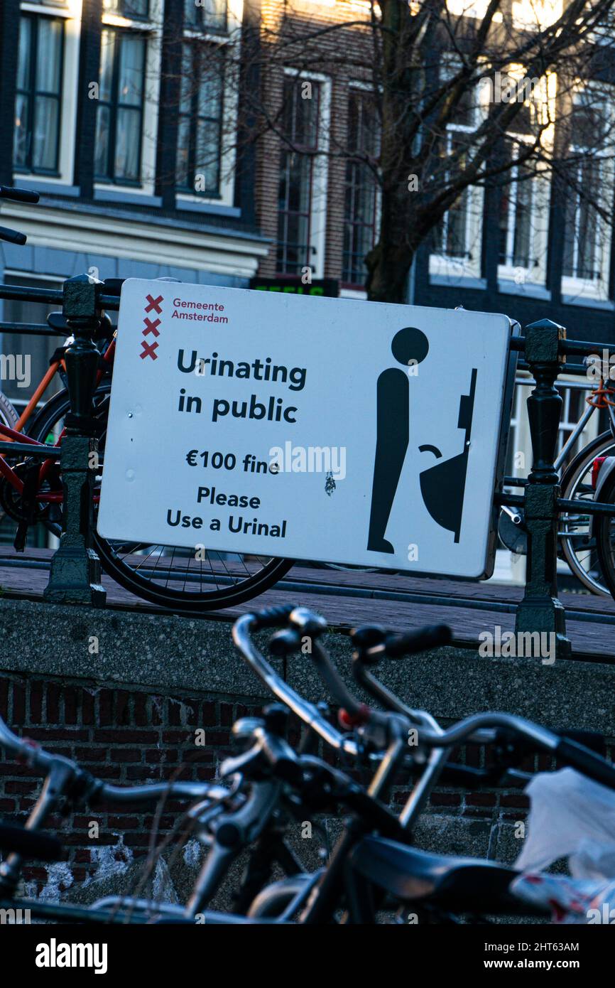 Warning sign "urinating in public is 100 euros fine" in the street of ...