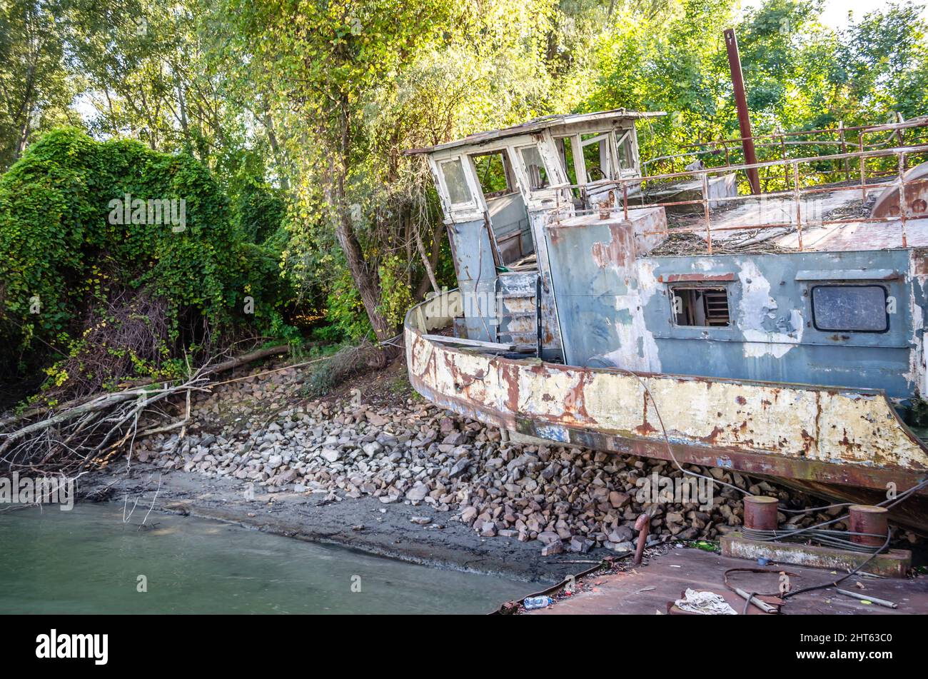 Stranded Old abandoned tanker wreck on the banksof the Danube River in ...